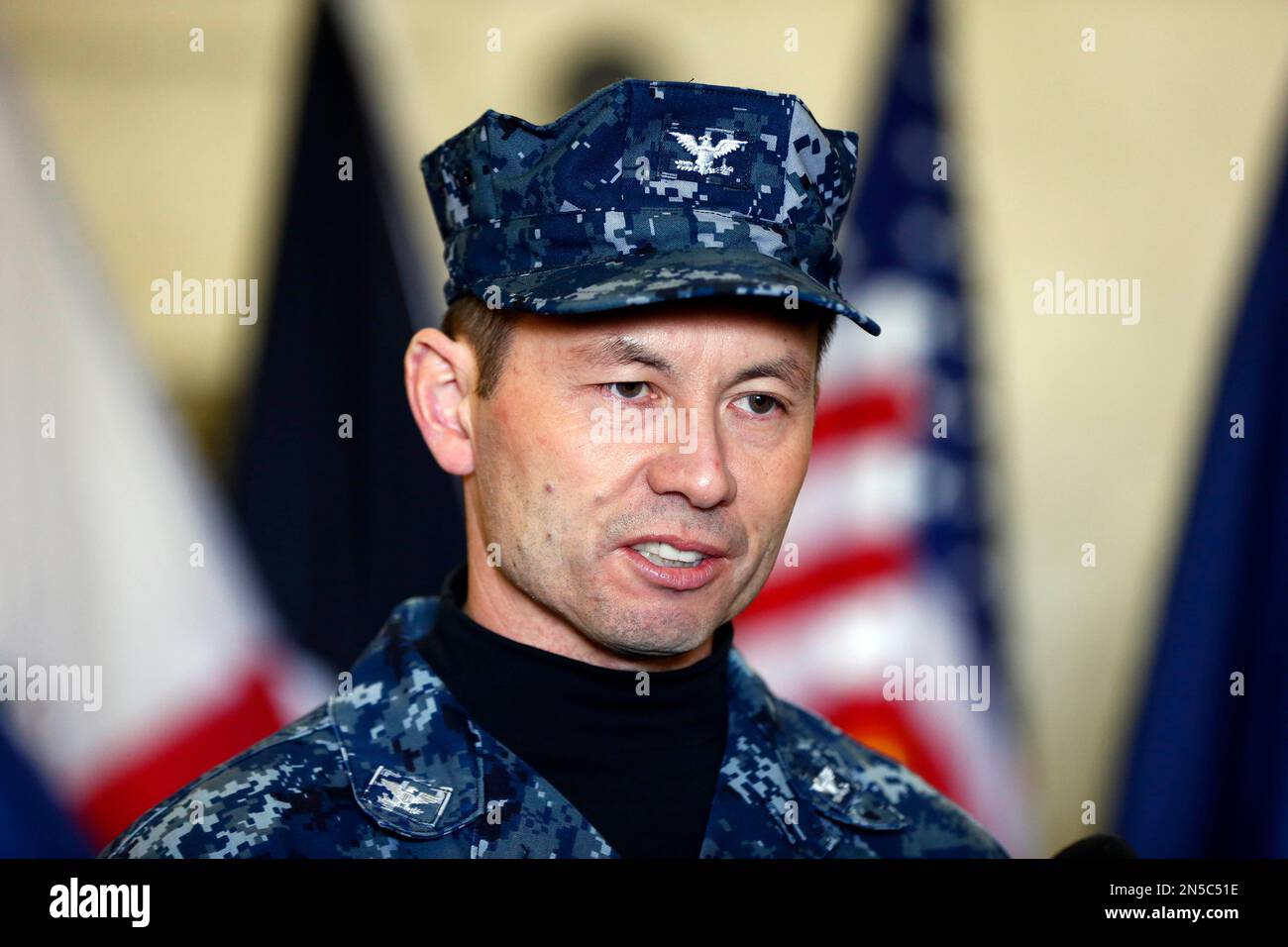Commanding Officer Capt. Thomas Dearborn speaks to member of the media ...