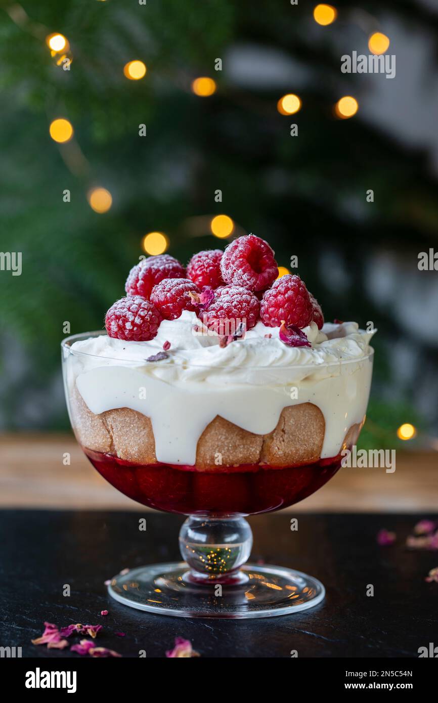 Raspberry trifle with fruit jelly, custard and cream Stock Photo - Alamy