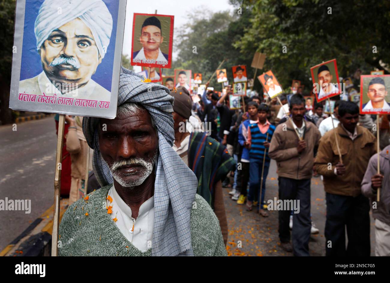 Indians carrying photographs of Indian freedom fighters, walk in a ...