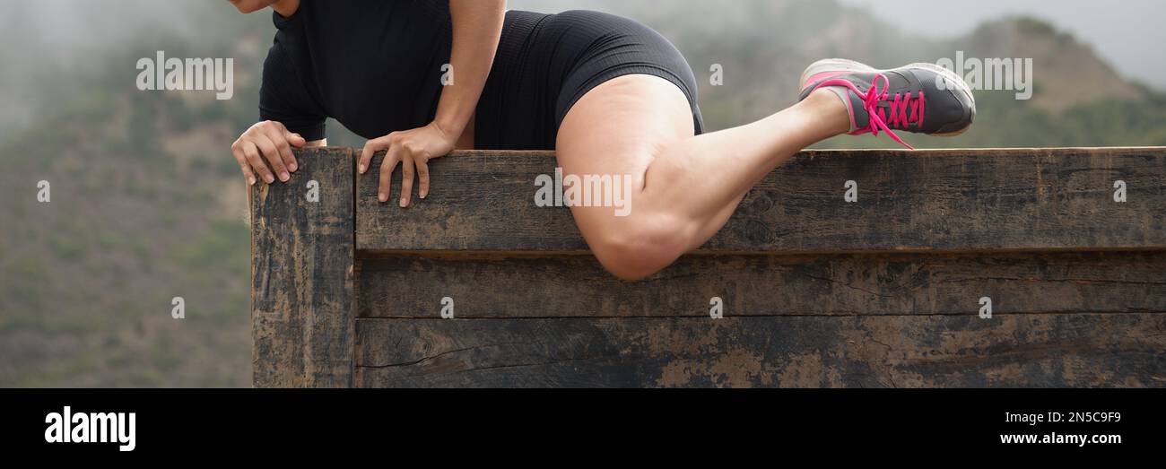 Person climbing over wall hi-res stock photography and images - Alamy