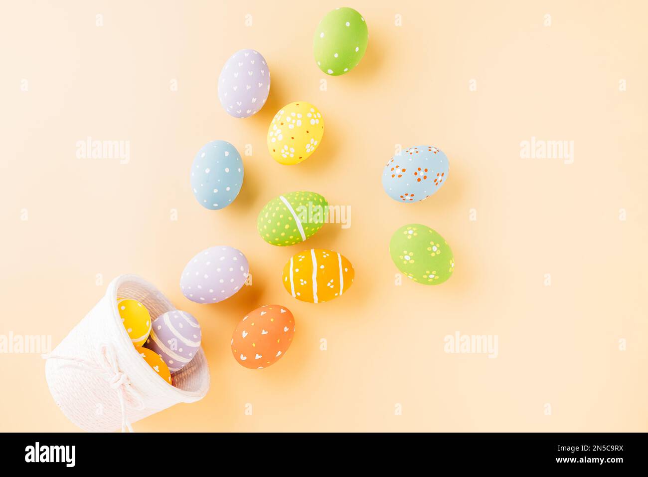 Top view easter eggs in basket filled fall down spread Stock Photo - Alamy