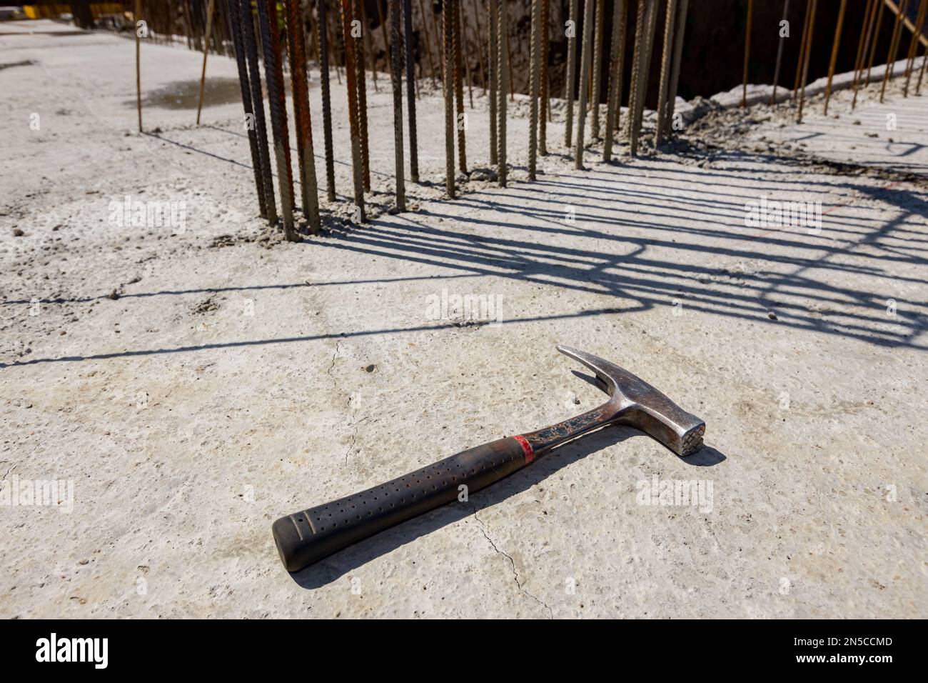 Used tool, mason's hammer, metal handled with rubber, placed on ...