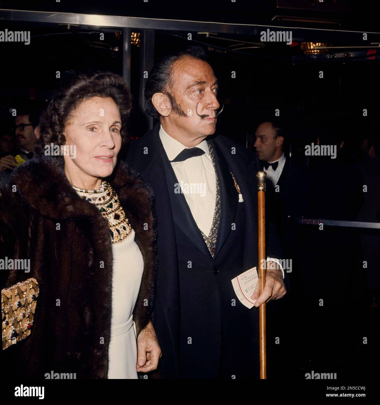 Spanish painter Salvador Dali, with his wife Gala attending the ...