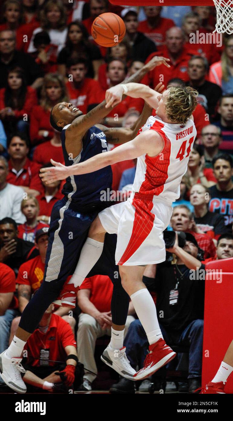 Utah State's Jarred Shaw's shot is blocked by New Mexico's Cameron ...