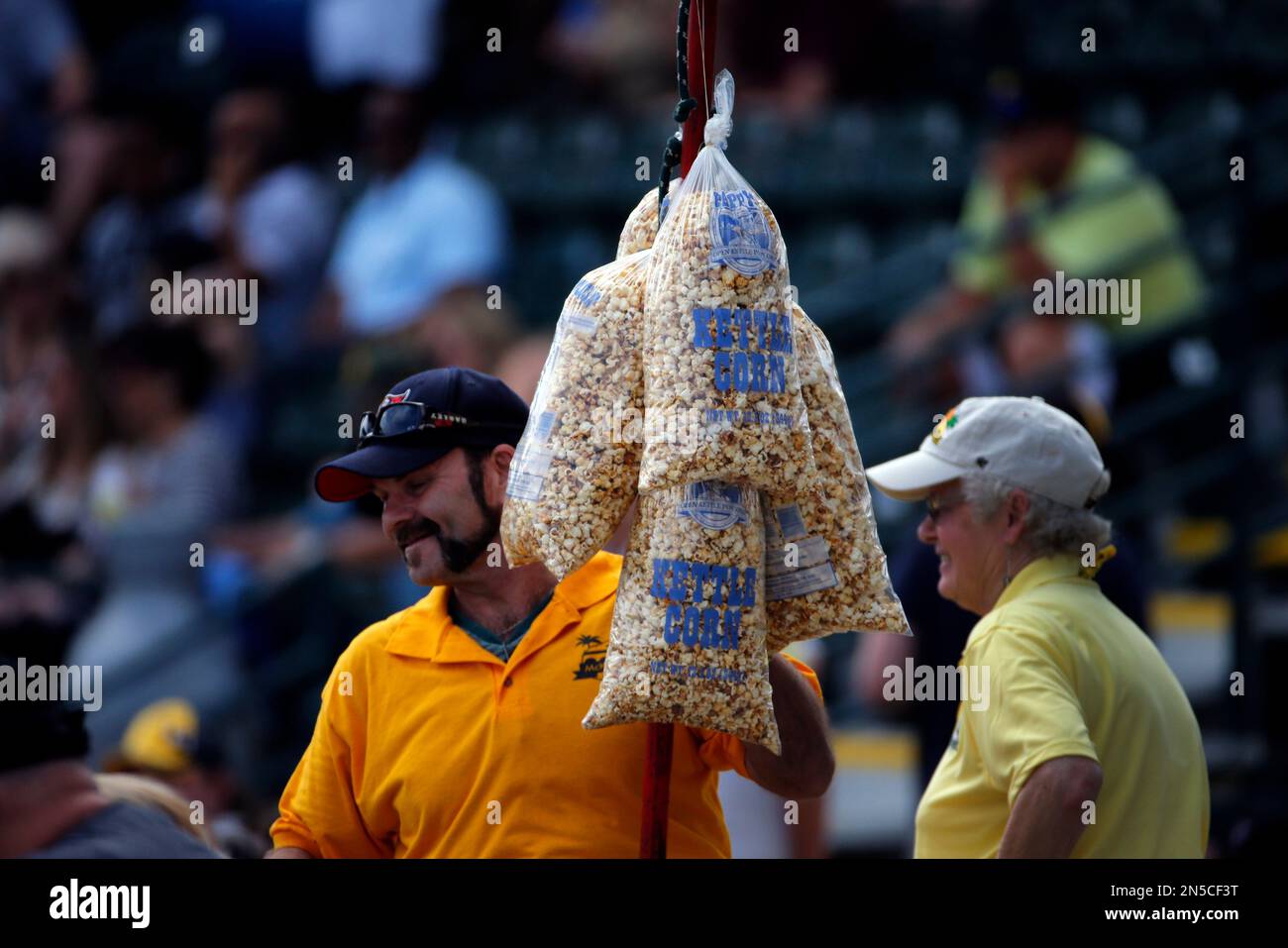 A McKechnie Field popcorn vendor works the crowd attending the ...
