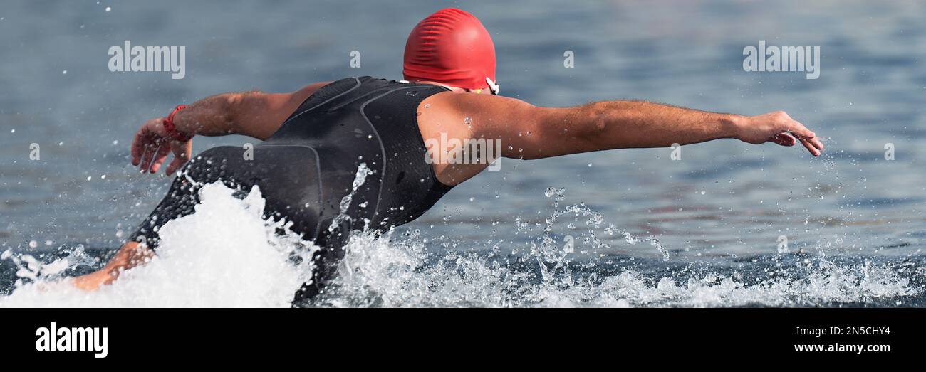 Swimmer at the start, jump flight into the ocean Stock Photo - Alamy