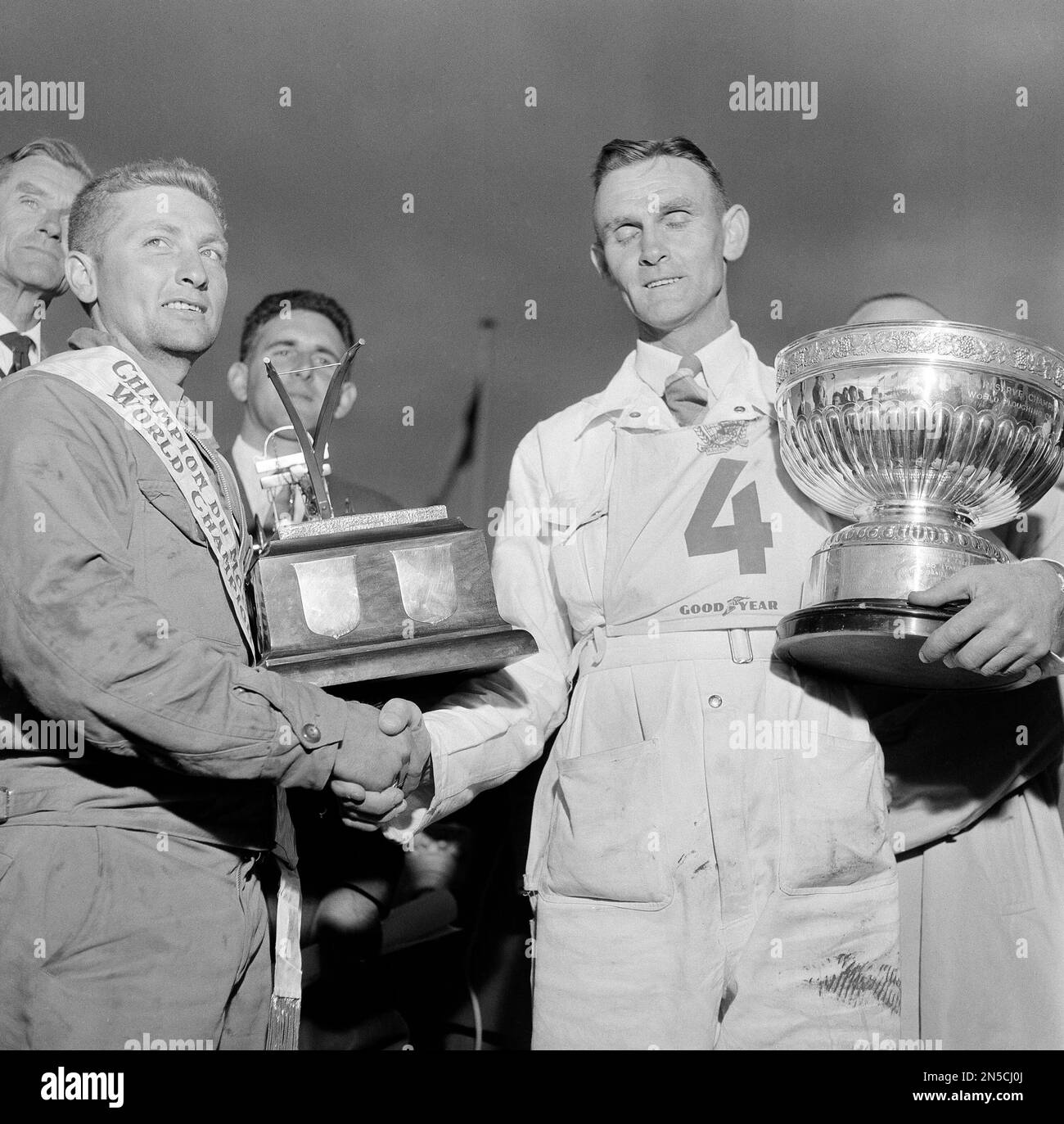 Canadian William Dixon (left) holds his golden plough trophy after ...