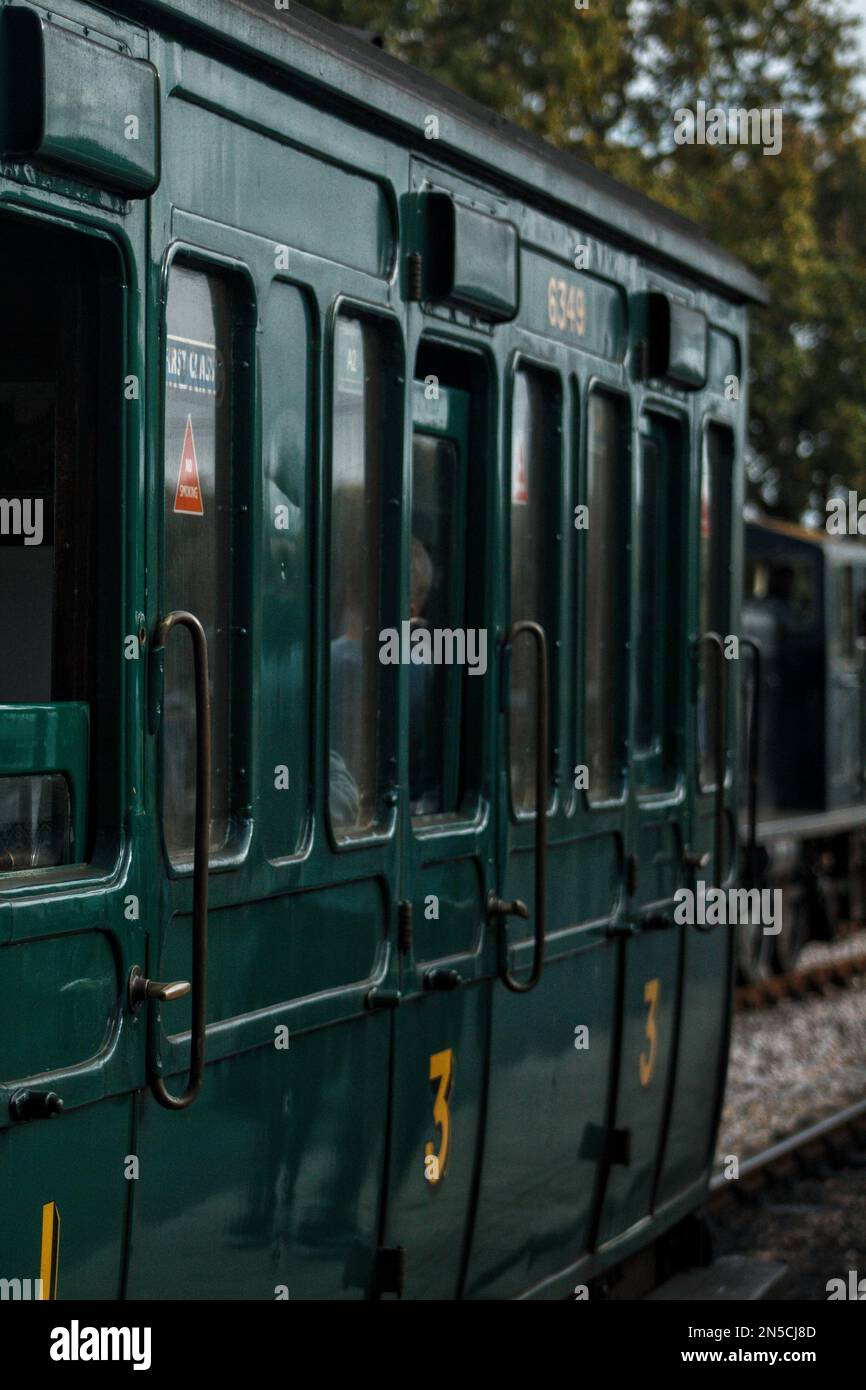 A vertical closeup o f the side of dark green train wagon Stock Photo ...