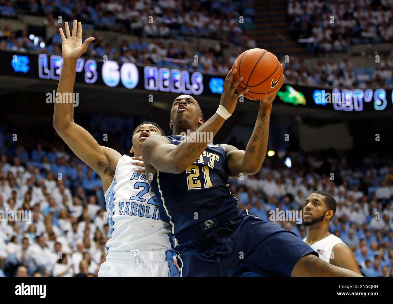 Pittsburgh's Lamar Patterson (21) drives the ball into North Carolina's ...