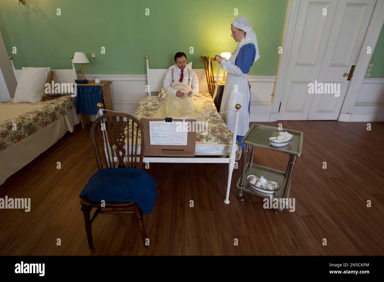 Actress Katie McArdle and actor Nick Whitley act out a scene on a ward ...