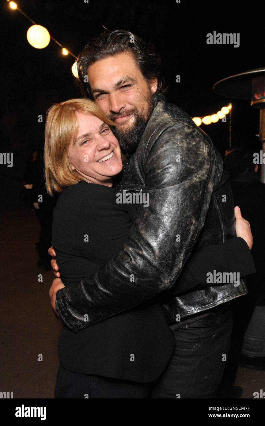 Executive producer Sarah Condon, left, and Jason Momoa attend the ...