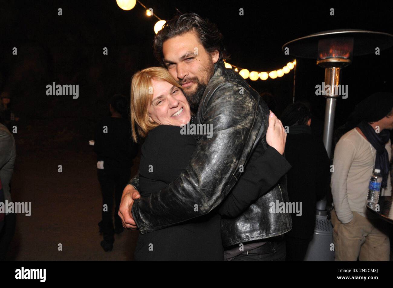 Executive producer Sarah Condon, left, and Jason Momoa attend the ...