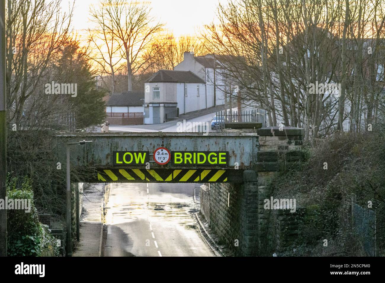 Low bridge sign on railway bridge, UK Stock Photo - Alamy