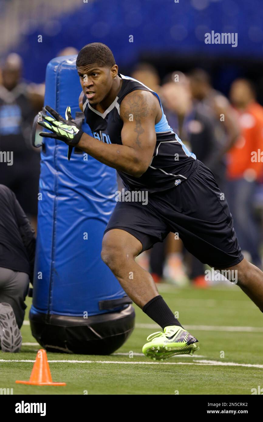 Missouri defensive lineman Kony Ealy runs a drill at the NFL football ...