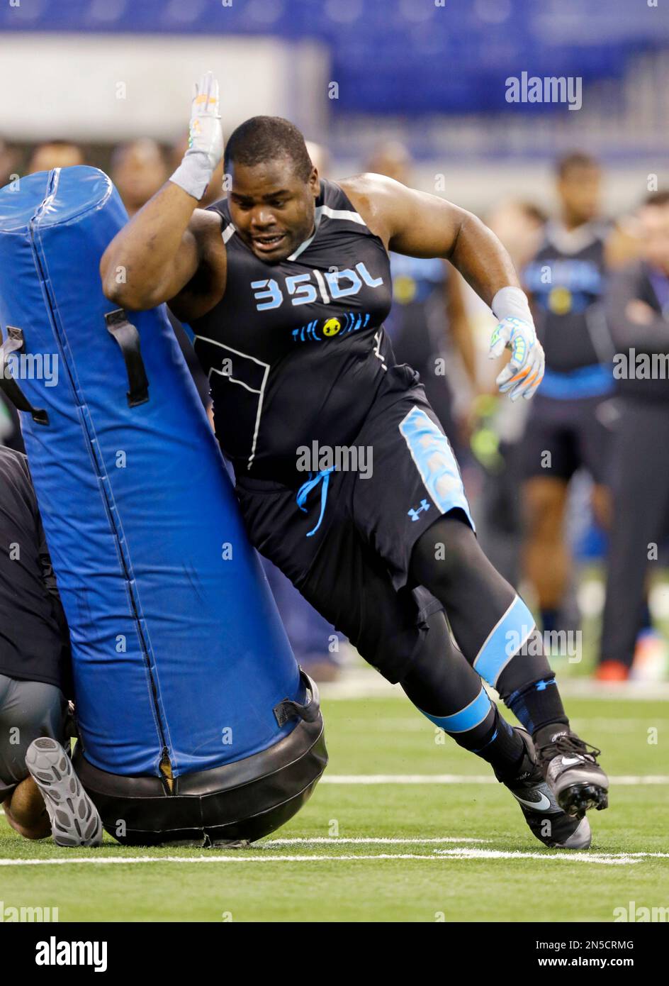 Notre Dame defensive lineman Louis Nix runs a drill at the NFL football ...