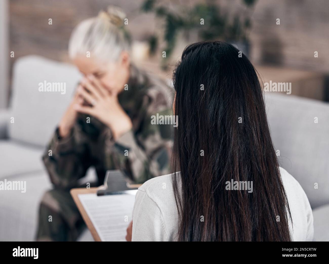 Soldier woman, psychologist and crying on sofa for therapy, ptsd and ...