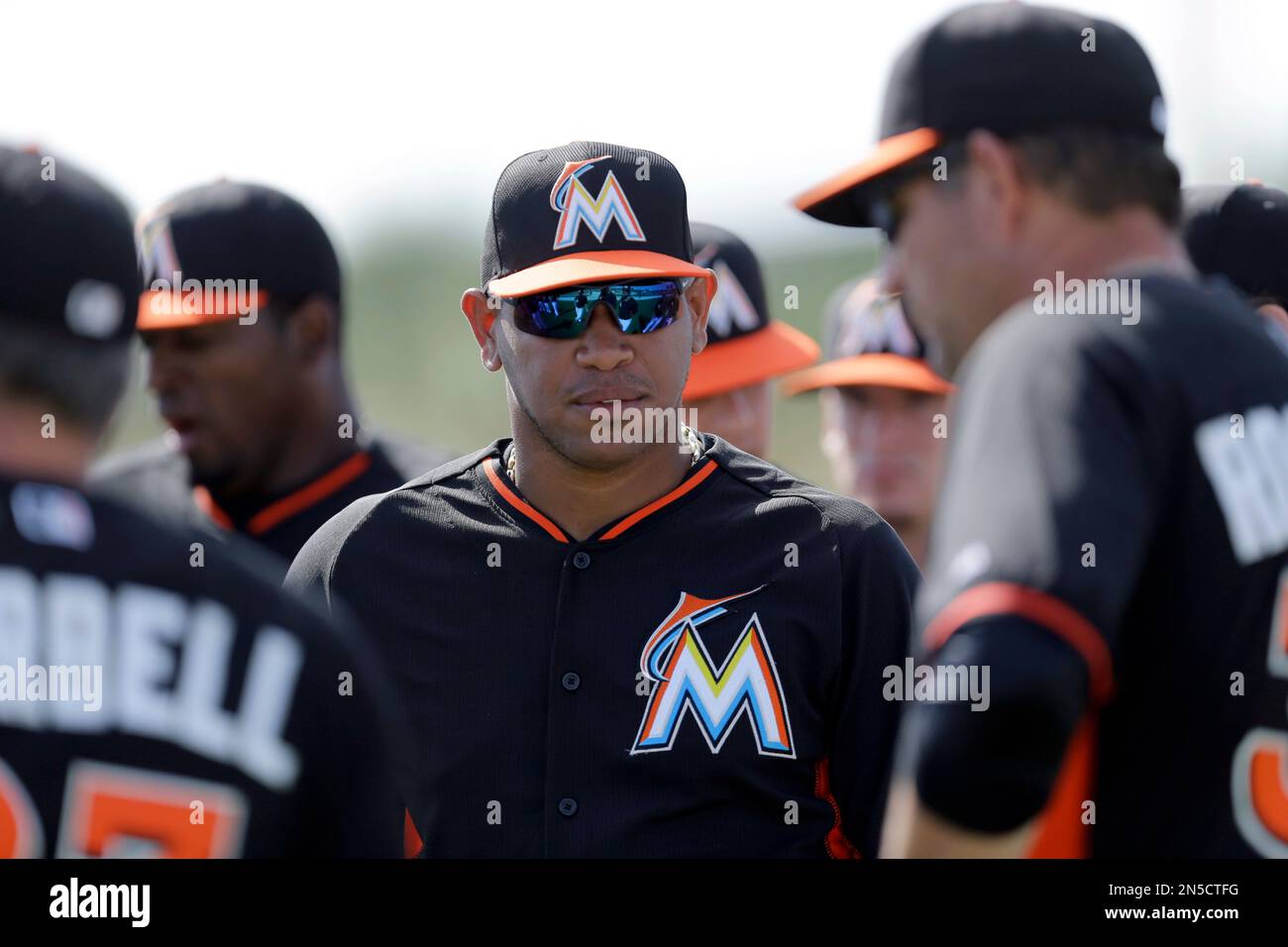Miami Marlins pitcher Carlos Marmol stands with his teammates at the ...