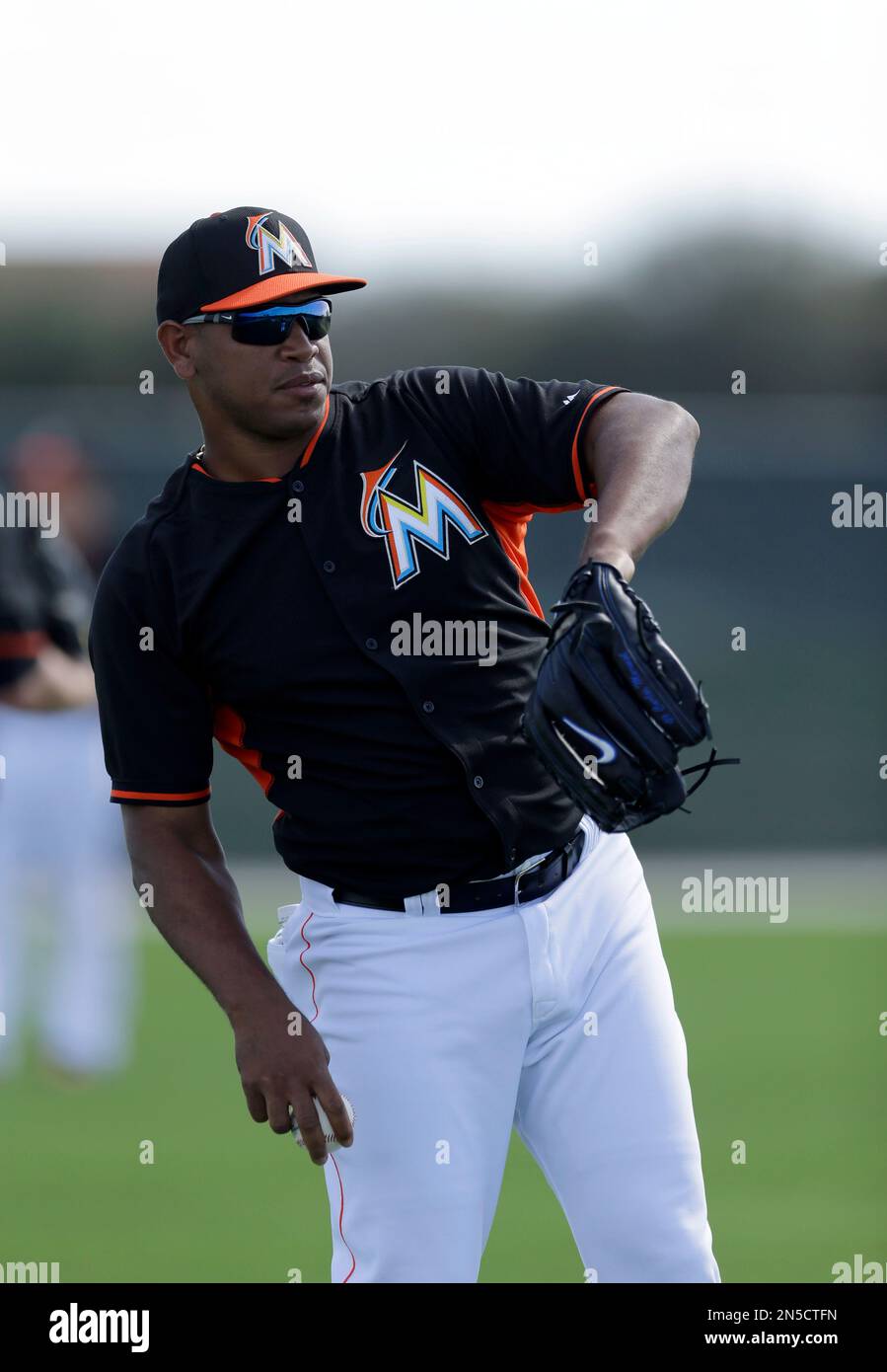 Miami Marlins pitcher Carlos Marmol warms up at the start of a spring ...