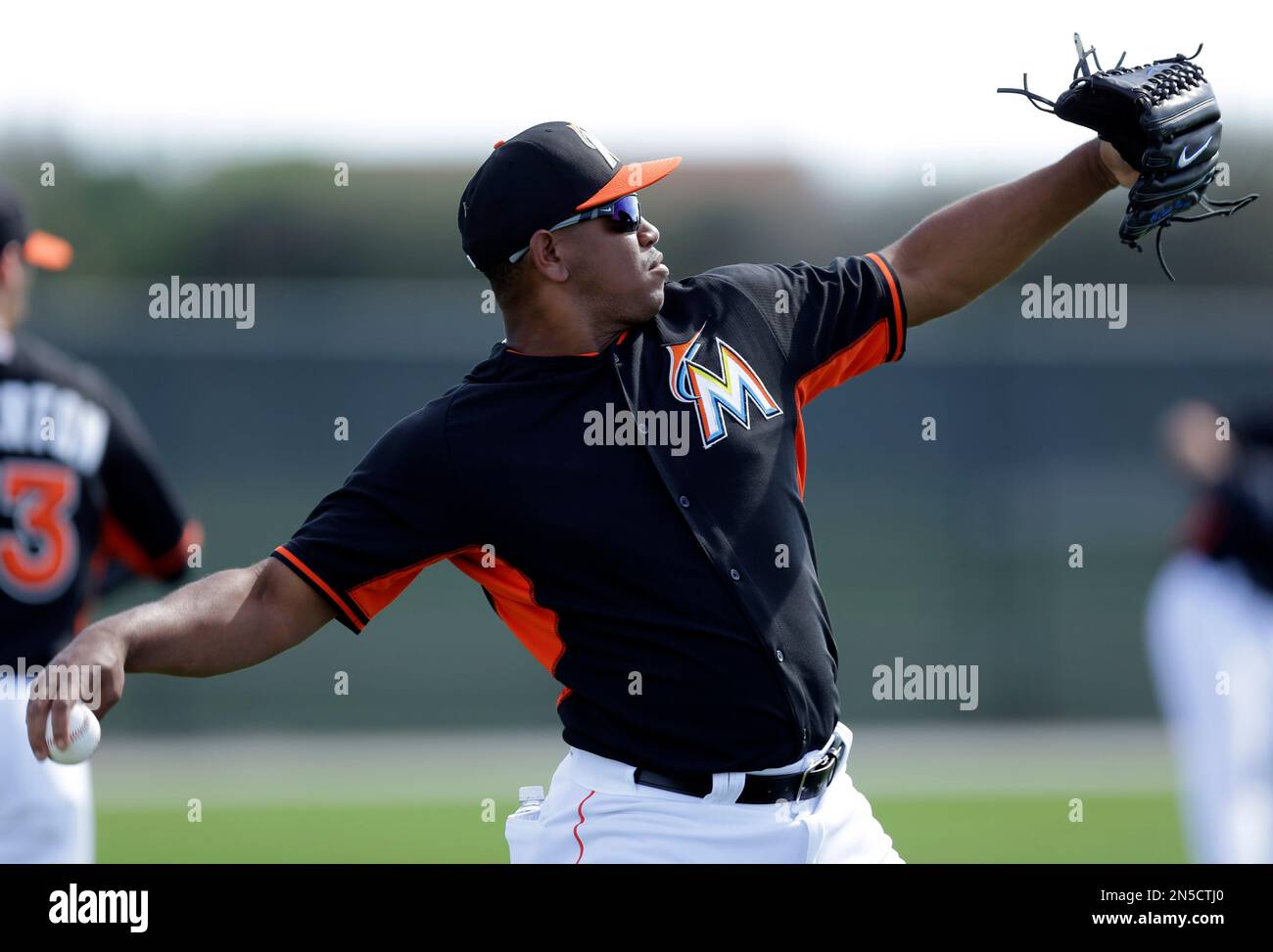 Miami Marlins pitcher Carlos Marmol warms up at the start of a spring ...