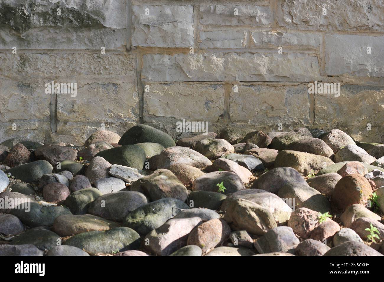 Rocks and stones piled high in the rock garden Stock Photo - Alamy