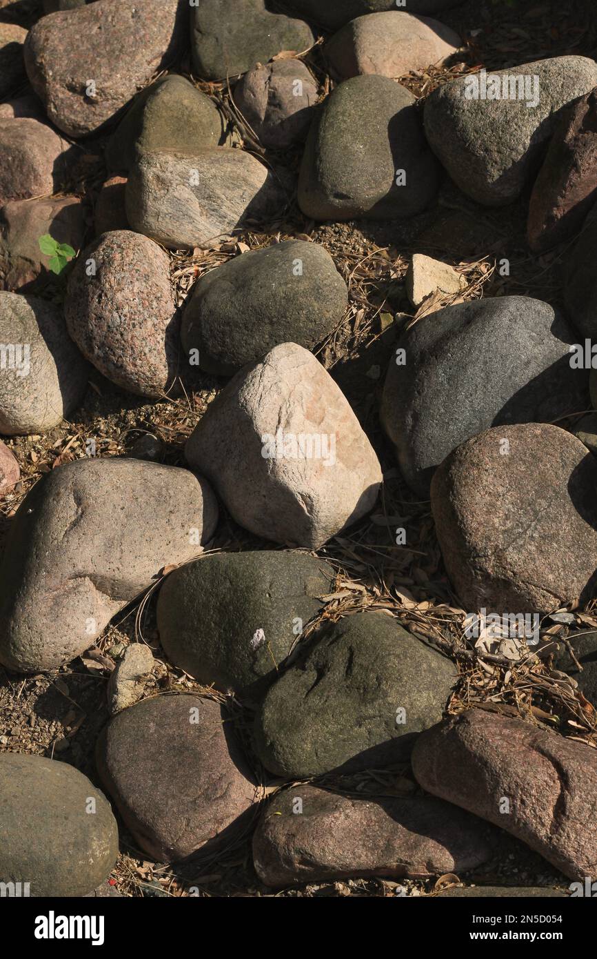 Rocks and stones piled high in the rock garden Stock Photo - Alamy