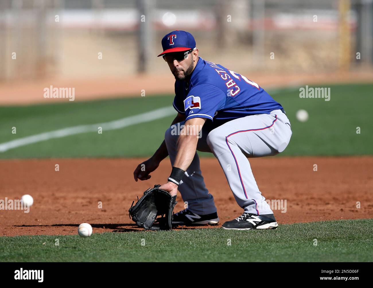Texas Rangers infielder Alex Castellanos fields a ground ball during ...