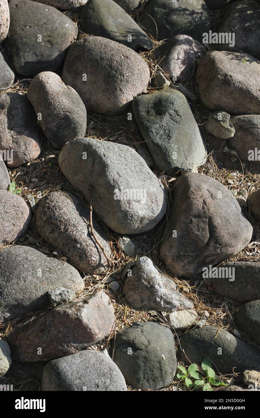 Rocks and stones piled high in the rock garden Stock Photo - Alamy