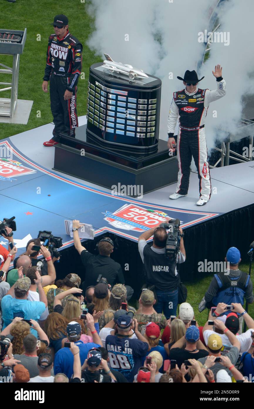 Martin Truex Jr. and Austin Dillon, right, stand on the stage during ...