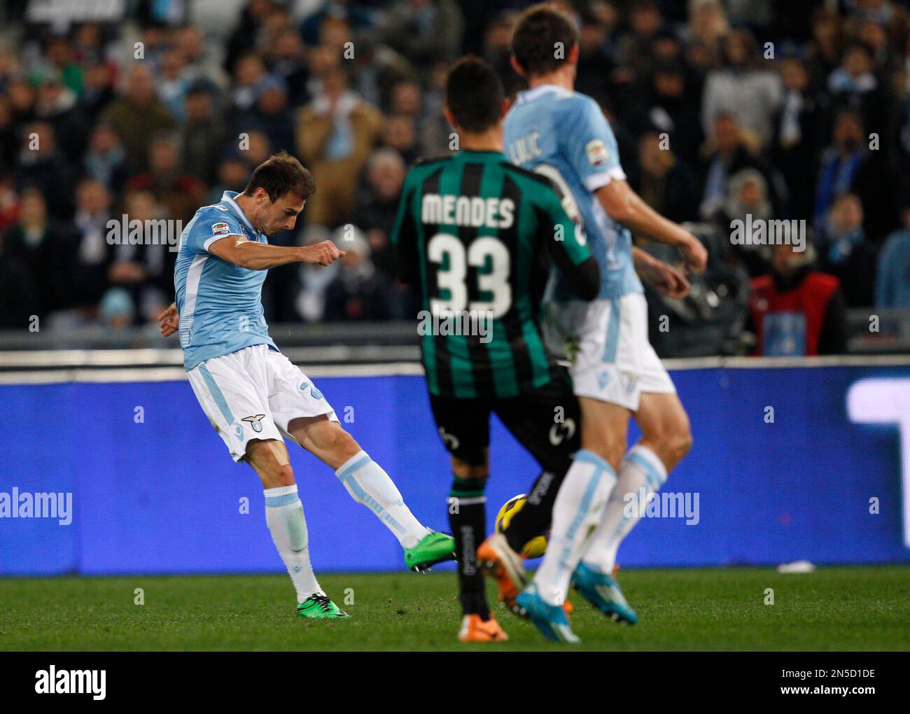 Lazio defender Stefan Radu, of Romania, left, kicks to score during a ...