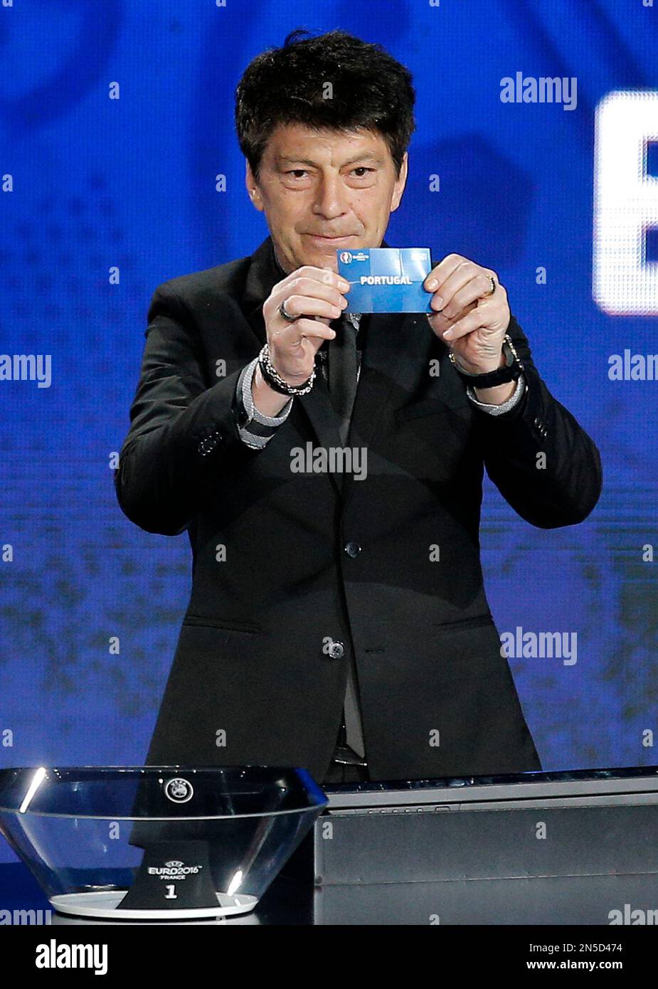 Russian former soccer goalkeeper Rinat Dasayev shows the draw of ...