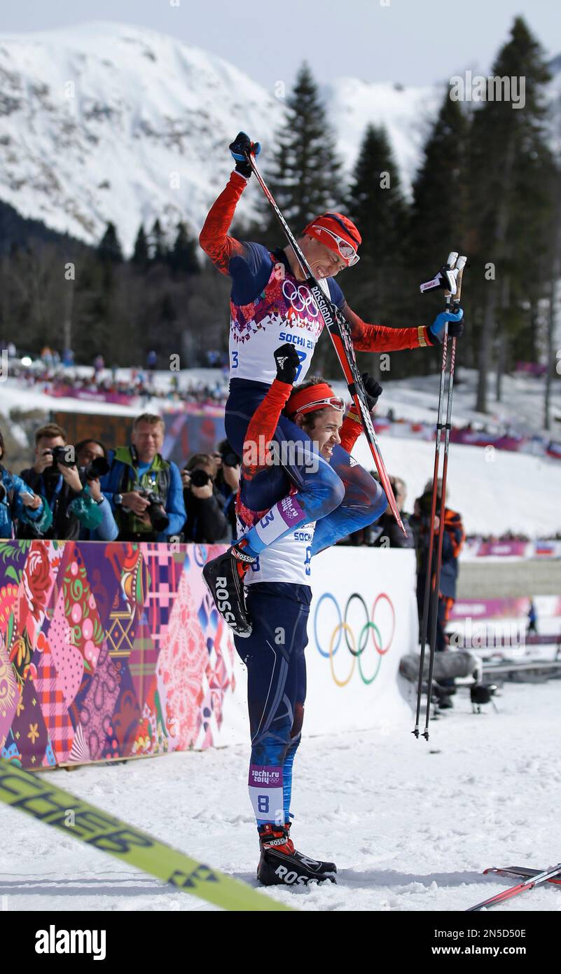 Russia's Alexander Legkov, the gold medal winner, is carried on the ...