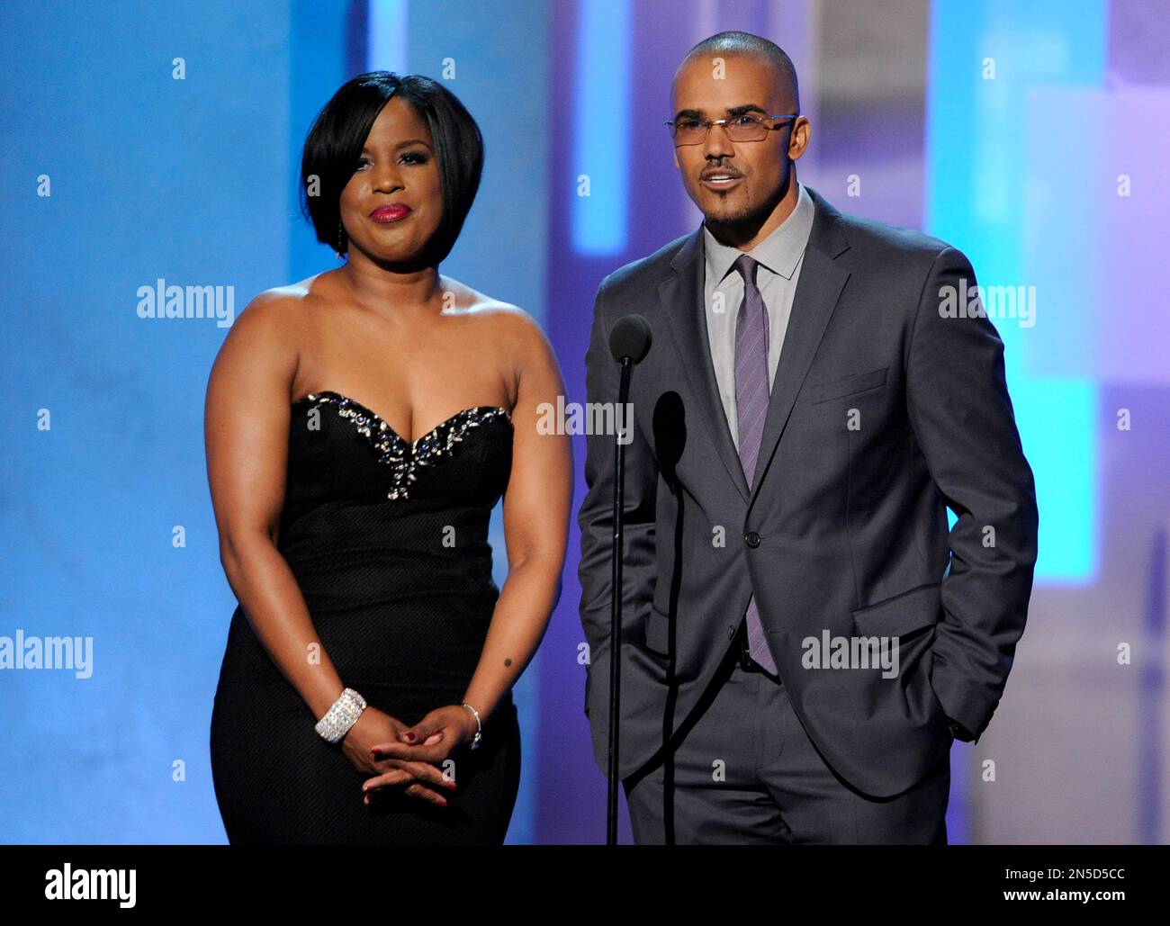 NAACP chairman Roslyn M. Brock, left, and Shemar Moore speak on stage ...