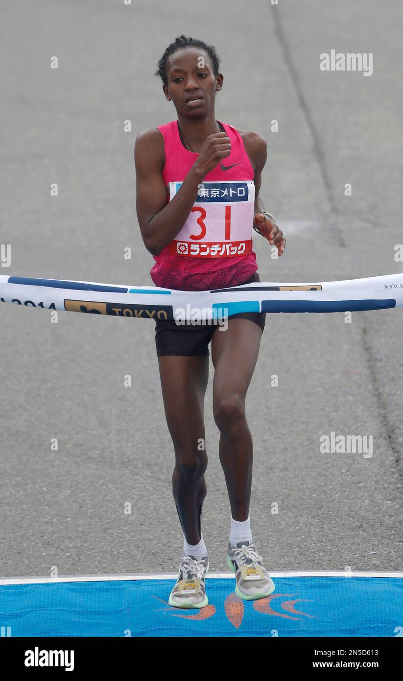 Caroline Rotich of Kenya crosses the finish line to place her third in ...