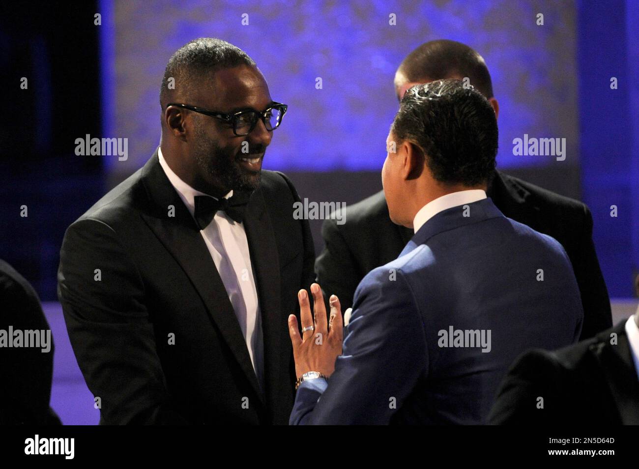Idris Elba, left, and Terrence Howard speak in the audience at the 45th ...