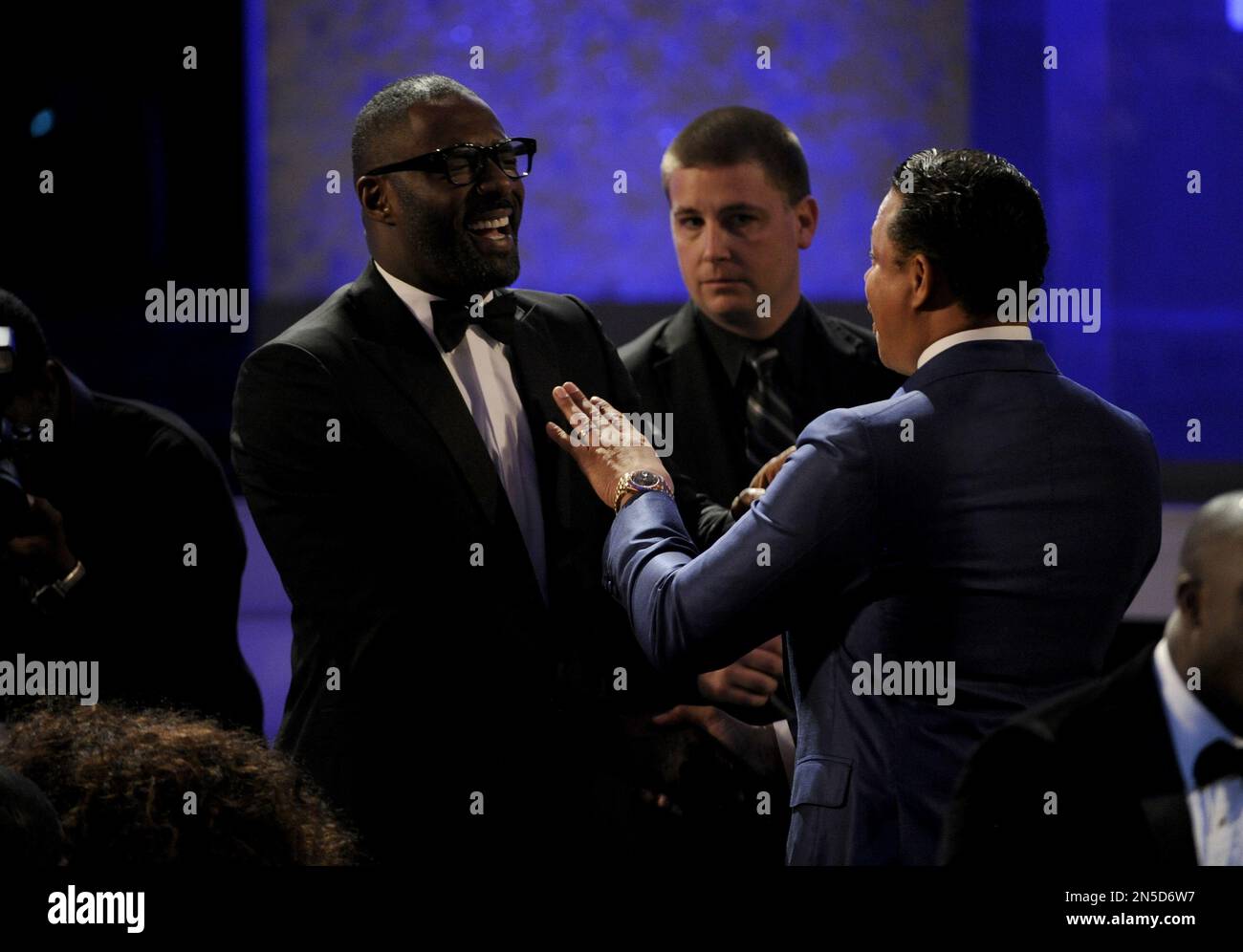 Idris Elba, left, and Terrence Howard speak in the audience at the 45th ...