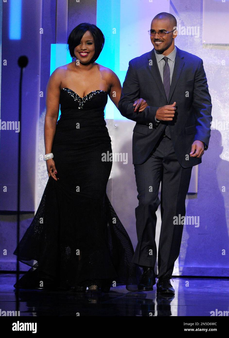 NAACP chairman Roslyn M. Brock, left and Shemar Moore walk on stage at ...