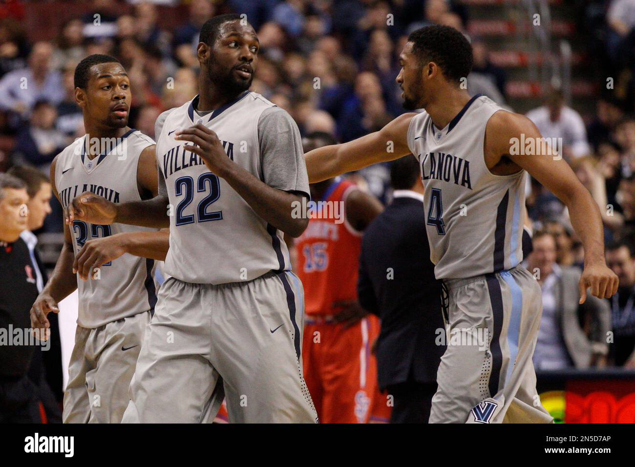 Villanova's JayVaughn Pinkston, center, heads back to the bench with ...