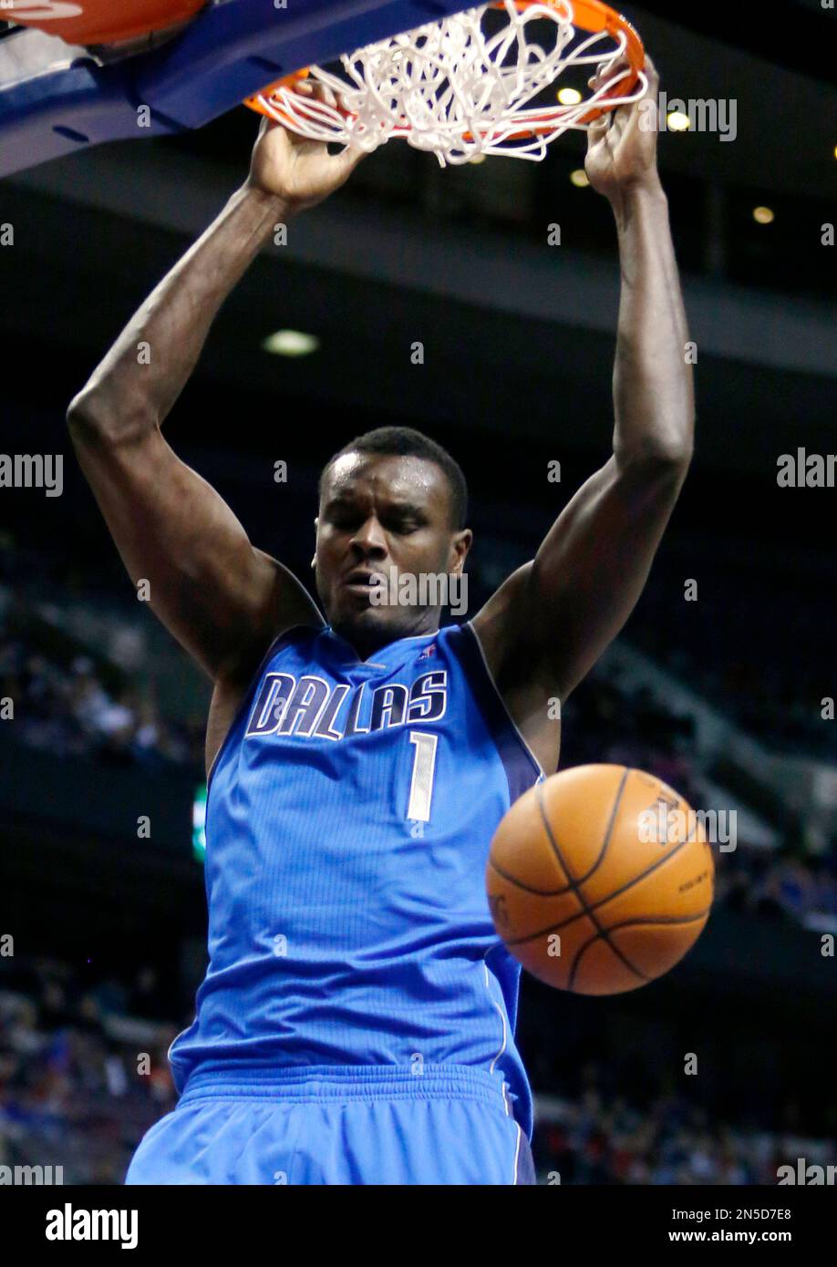 Dallas Mavericks center Samuel Dalembert dunks against the Detroit ...