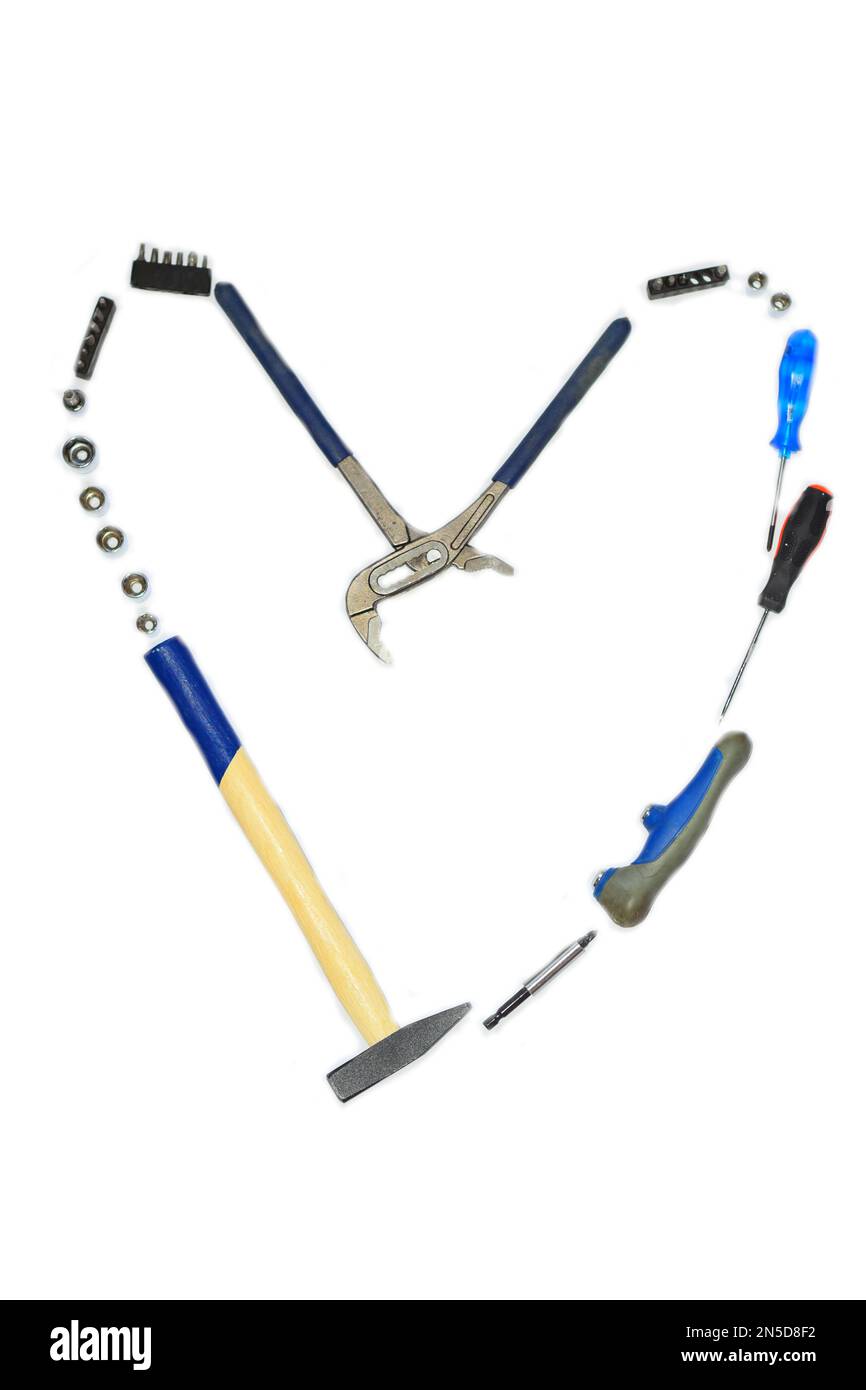 Tools shaped in heart concept. Hammer, snap on, screwdriver, pliers on ...