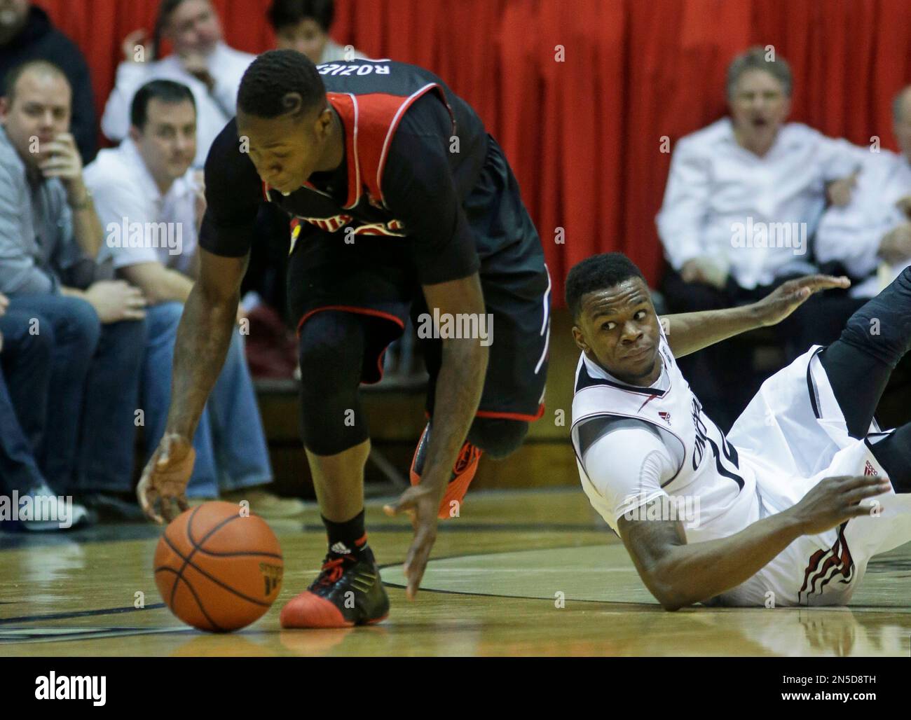 Louisville guard Terry Rozier steals the ball from Cincinnati guard Ge ...