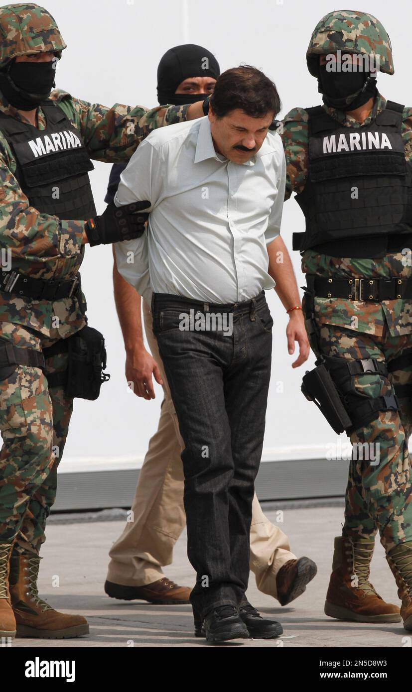 Joaquin El Chapo Guzman Is Escorted To A Helicopter In Handcuffs By