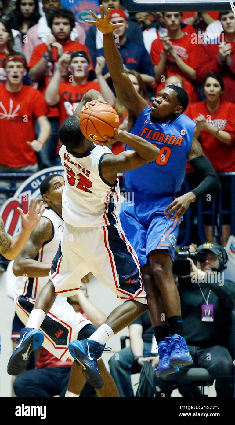 Florida guard Michael Frazier II (20) reaches up to block a shot ...