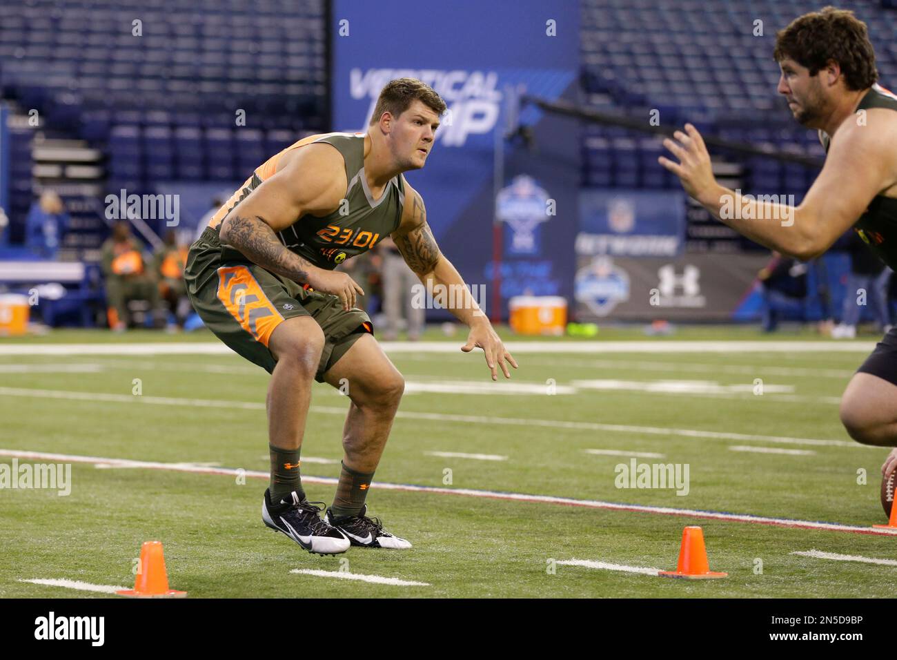 Michigan offensive lineman Taylor Lewan runs a drill at the NFL ...
