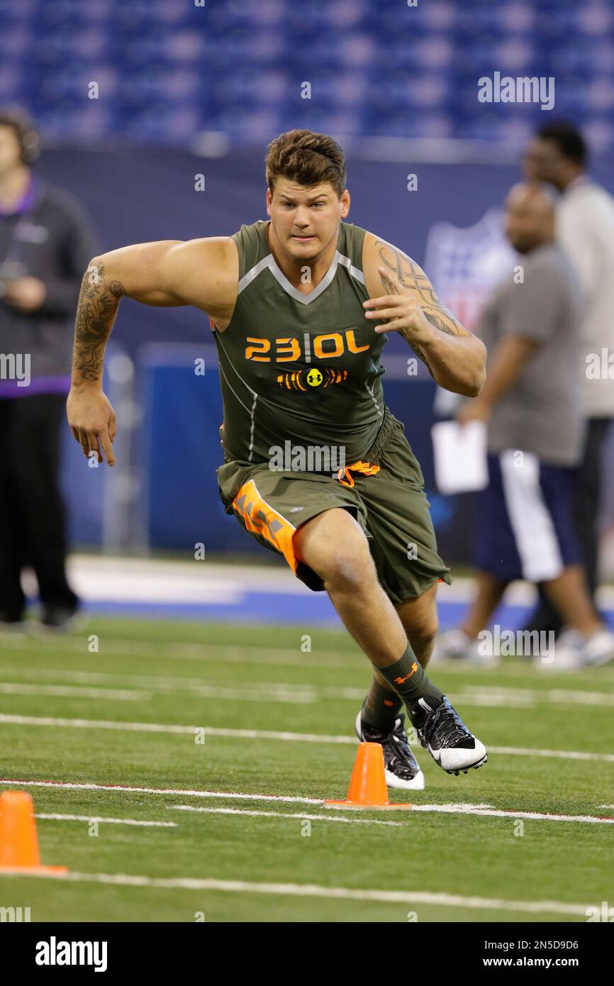 Michigan offensive lineman Taylor Lewan runs a drill at the NFL ...