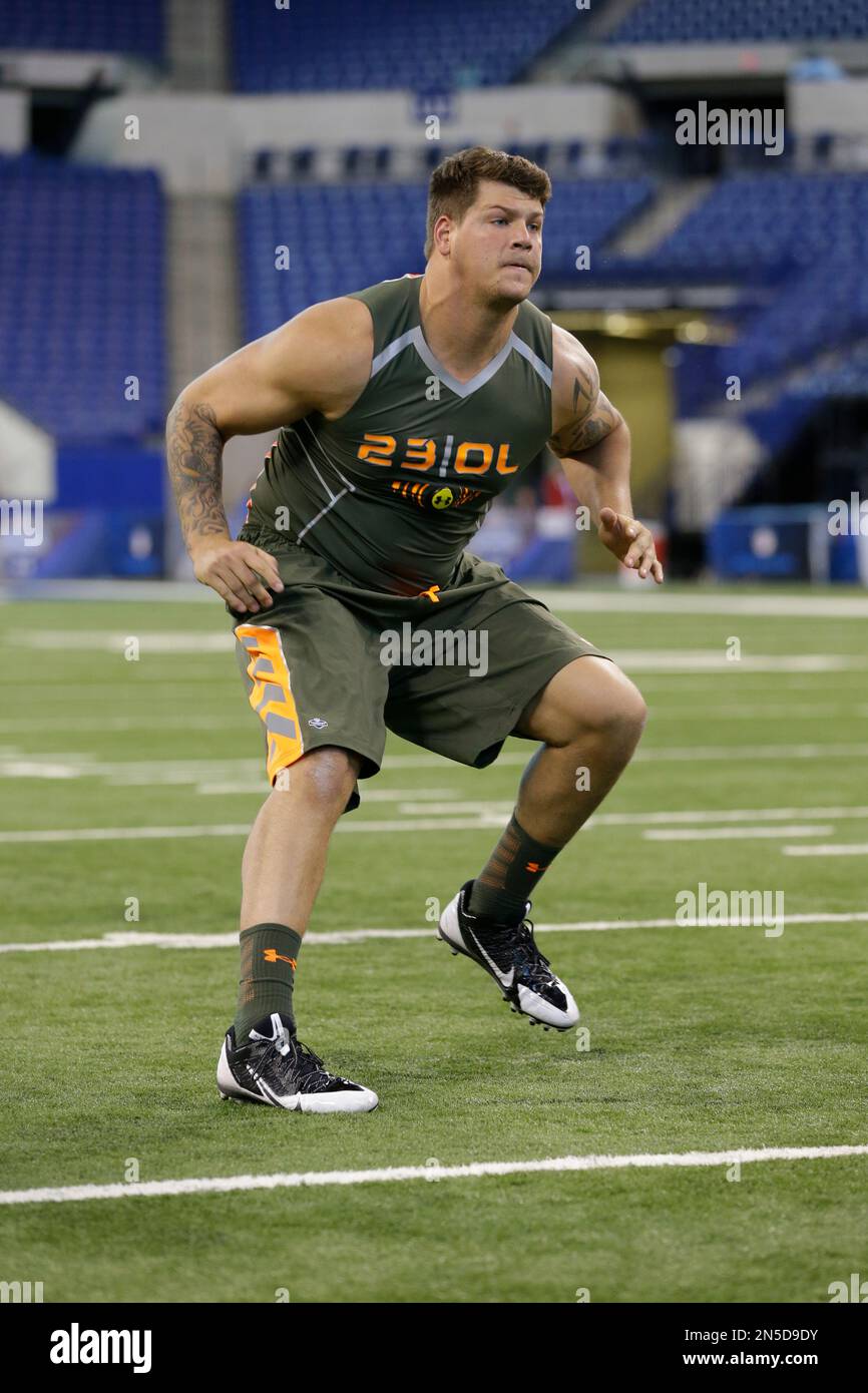 Michigan offensive lineman Taylor Lewan runs a drill at the NFL ...
