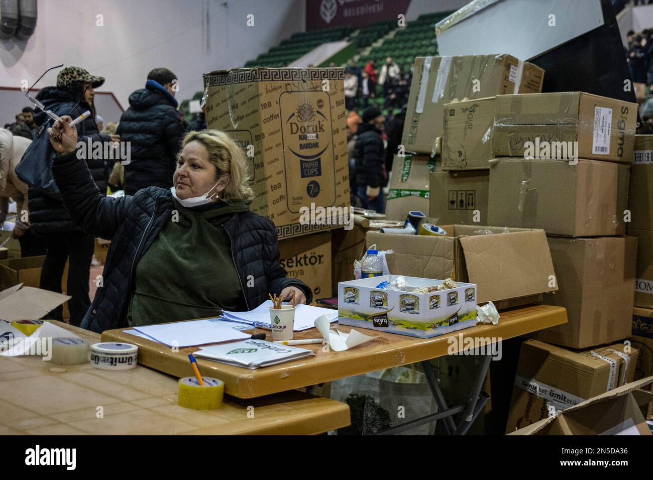 A registration desk is created in the aid donation room to register the ...