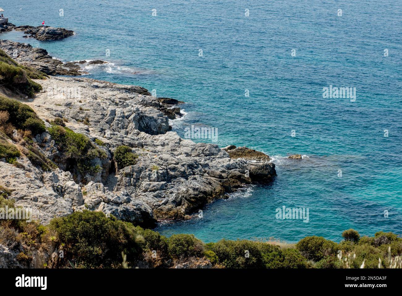 Bird's eye view of the blue sea, rocks in clear water, azure beach ...