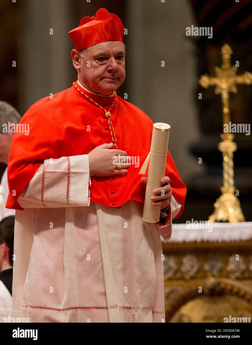 Newly-elected Cardinal Gerhard Ludwig Mueller, of Germany, leaves after ...