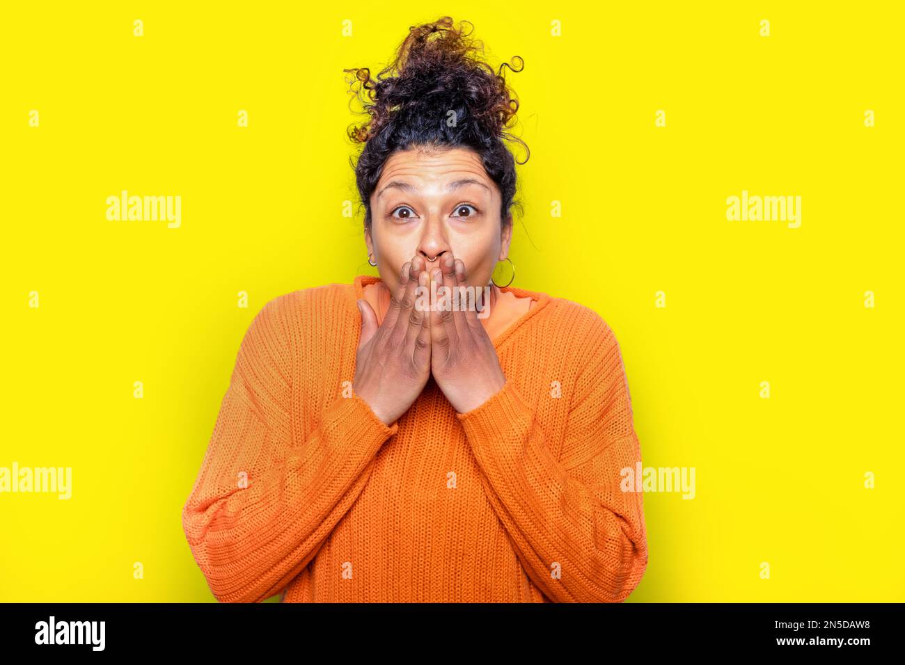 Black woman awe and astonishment face expression isolated on yellow ...
