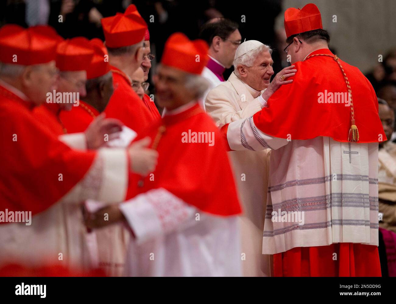 Newly-elected Cardinal Gerald Cyprien Lacroix, Archbishop of Quebec, is greeted by Pope Emeritus ...